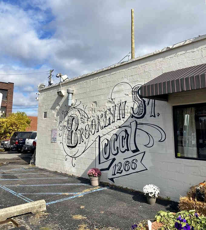 Ornate typography and autumn flowers create an Instagram-worthy backdrop for a neighborhood breakfast institution that delivers substance with style.