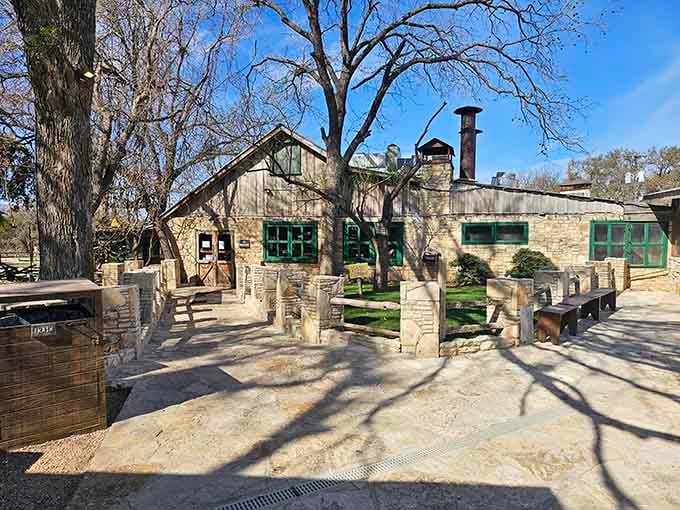 The courtyard's manicured lawn and towering trees prove barbecue joints can be beautiful too.