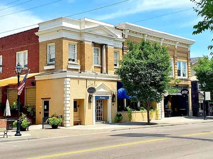 That yellow building pops like sunshine against its neighbors in this delightfully eclectic downtown streetscape.