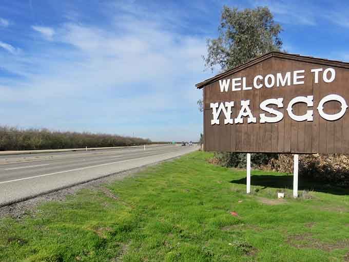 Green grass meets open highway, showing that Central Valley living still offers room to breathe deeply.
