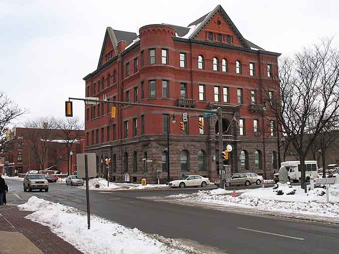Romanesque red stone and arched windows create Victorian grandeur that proves industrial cities once built structures meant to inspire and impress.