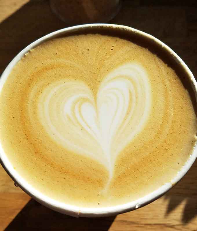 That latte art heart isn't just decoration, it's a visual representation of how you'll feel about this place.