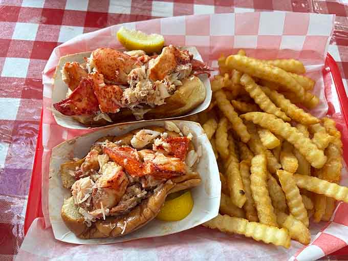 Two lobster rolls overflowing with meat, because apparently someone missed the memo about portion control and we're eternally grateful.