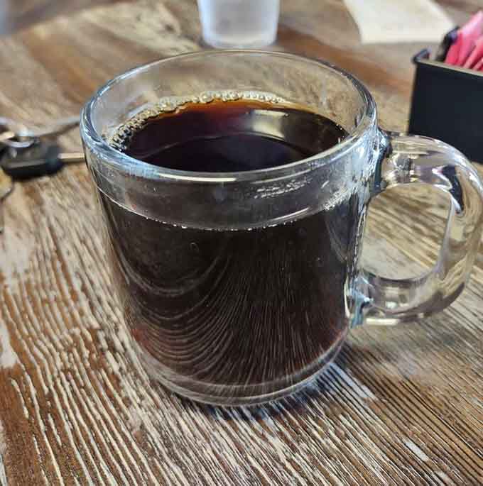 Hot coffee in a clear mug, the perfect companion for pie and the universal signal that good times await.