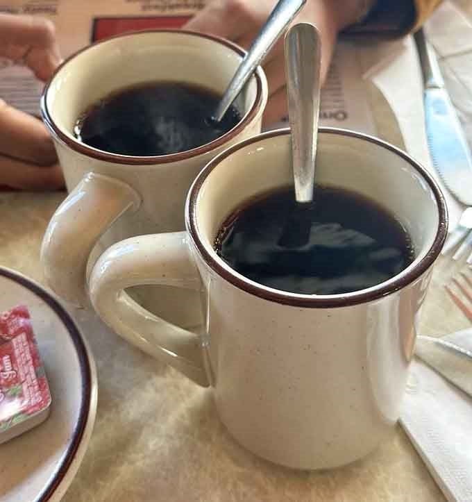 Two mugs of diner coffee, dark and honest, ready to jumpstart your day the old-fashioned way.