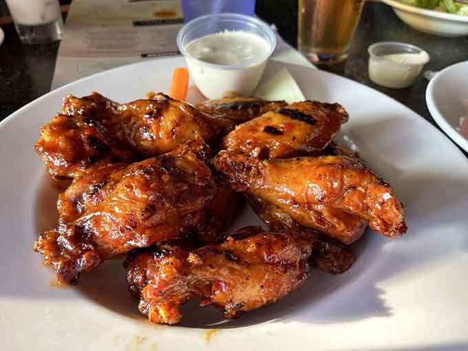 Wings glazed to perfection, because sometimes you need an opening act before the pizza headliner arrives.