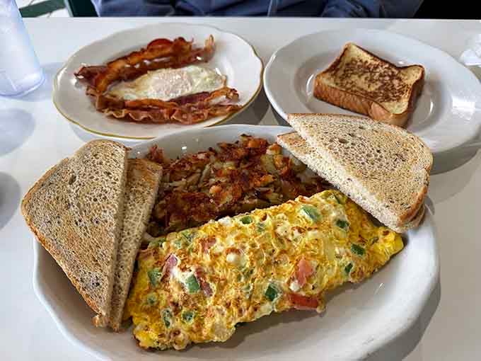 This spread has everything: pancakes, sausage, eggs, toast, and enough gravy to make your cardiologist write poetry.