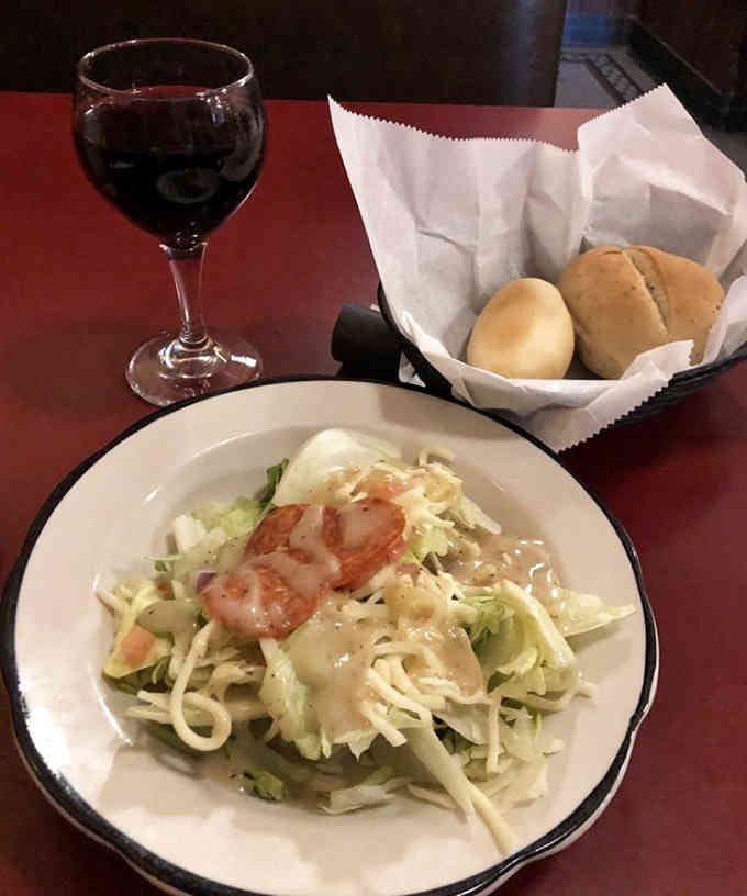 A simple house salad paired with red wine &ndash; because even in southern Illinois, people understand the importance of civilized dining.