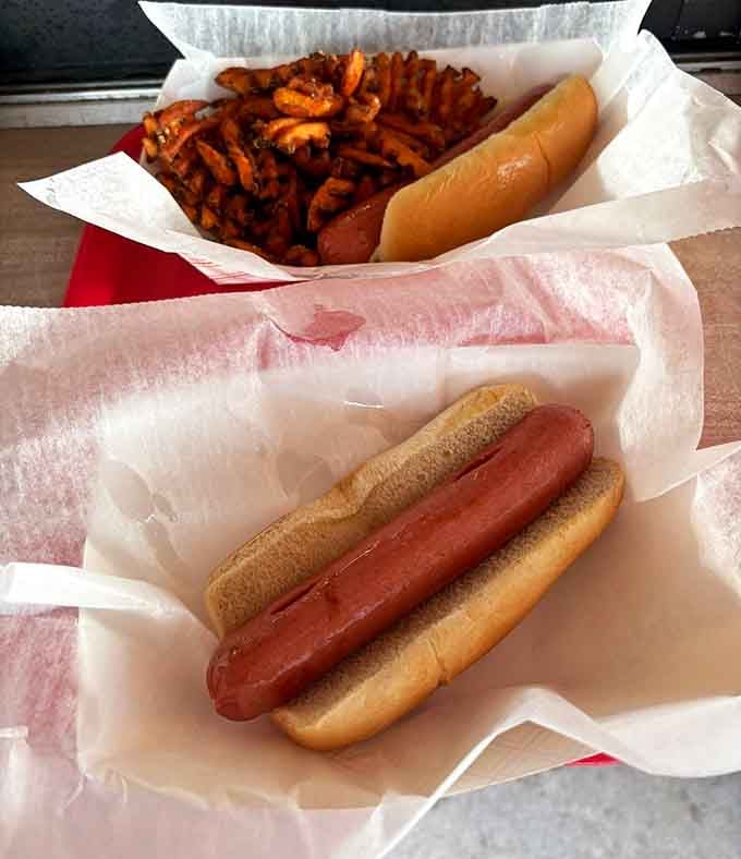 Classic hot dogs and curly sweet potato fries prove that simple pleasures never go out of style, ever.