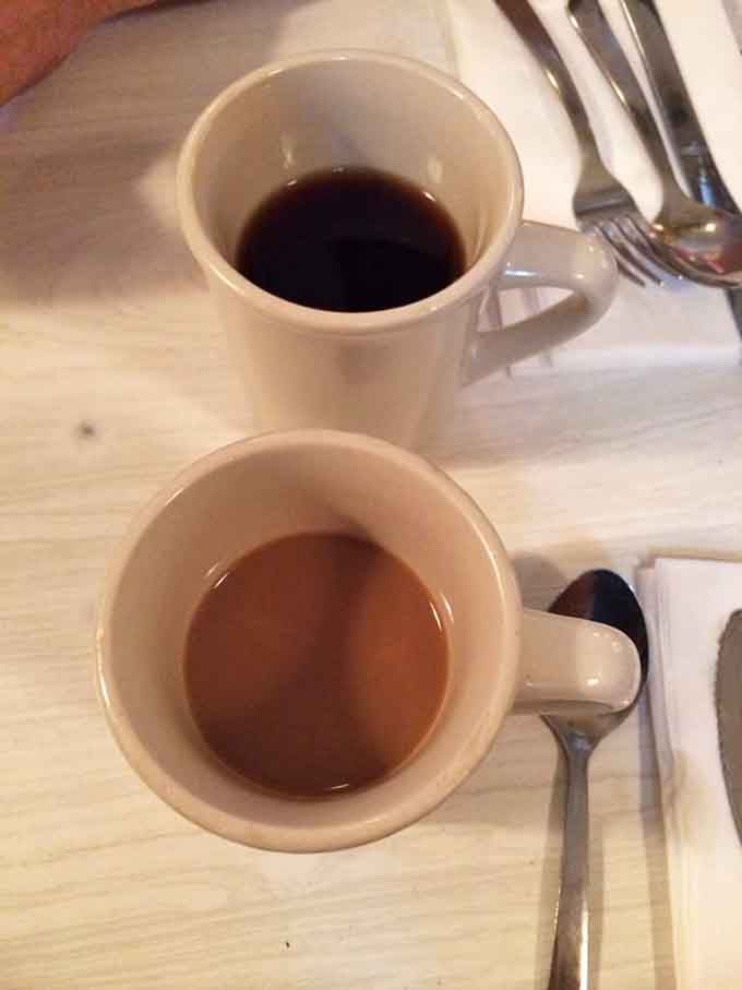 Two cups of coffee, black and ready: fuel for conversation, contemplation, and savoring every last bite.