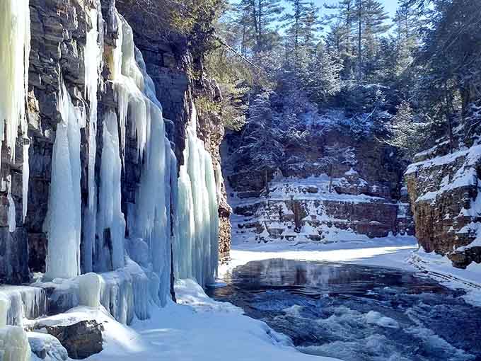 Winter transforms the waterfalls into frozen sculptures, proving that Ausable Chasm knows how to dress for every season spectacularly.
