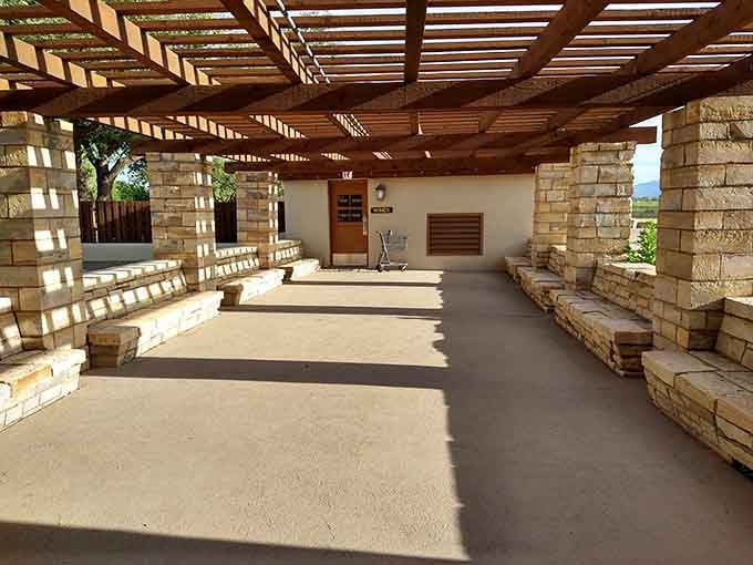 Classic stonework and thoughtful shade create a gathering spot that's stood the test of time since the 1930s.