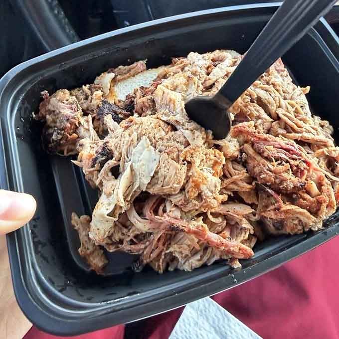 Pulled pork piled high with that gorgeous bark mixed in, smoky strands of pure barbecue heaven.