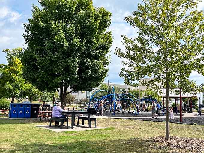 Shaded picnic spots and playground views mean parents can relax while kids burn off that endless energy.