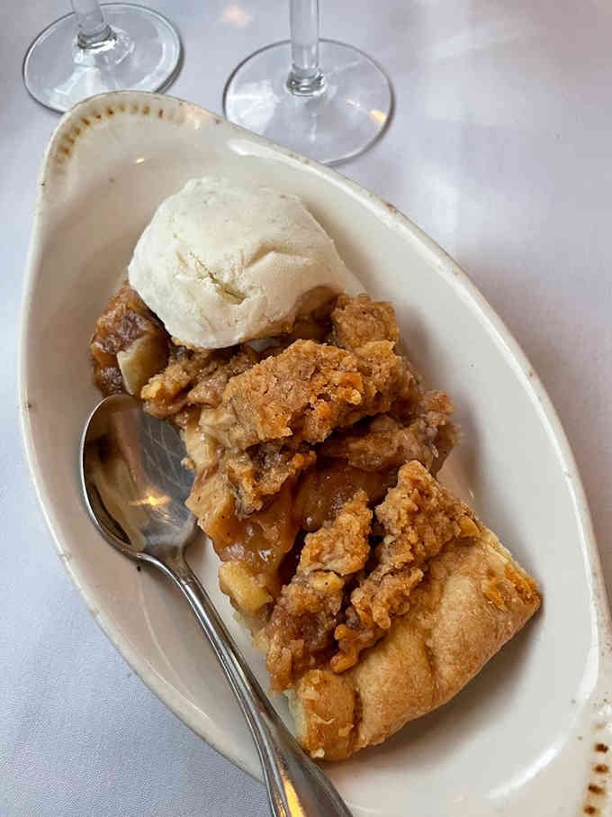 Apple pie with vanilla ice cream melting over warm crust is comfort food at its absolute finest.