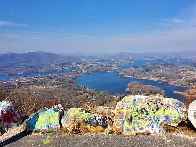 Those spray-painted rocks add unexpected character, like nature's canvas got a colorful makeover from grateful visitors.