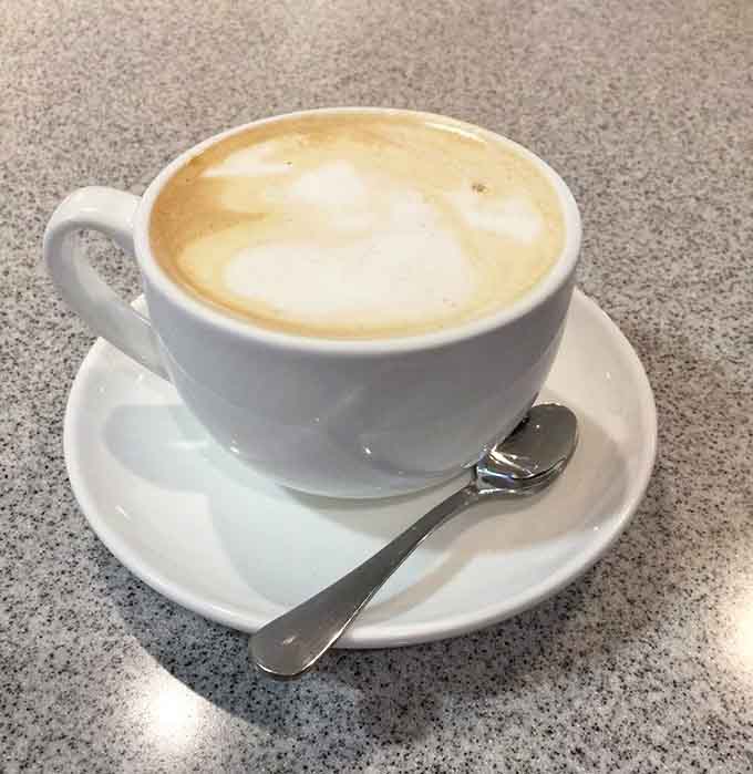 That perfectly foamed cappuccino sits ready to accompany whatever pastry weakness you're about to indulge in shamelessly.