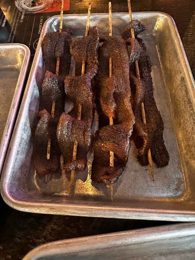 Bacon on a stick sounds like something you'd find at the state fair, but this candied version elevates it to art.