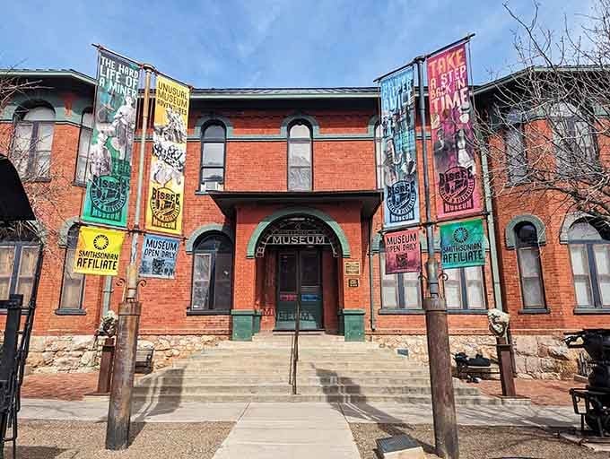 The Mining Museum's colorful banners promise stories inside, where Bisbee's gritty past gets the spotlight it deserves.