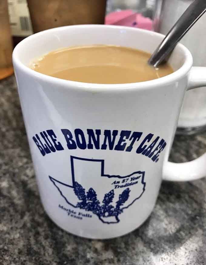 Coffee in a mug that proudly declares its Texas heritage—because even your caffeine should have a sense of place.