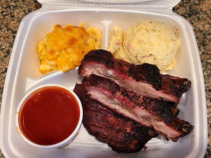 These ribs showcase that perfect smoke ring and bark that barbecue dreams are absolutely made of.