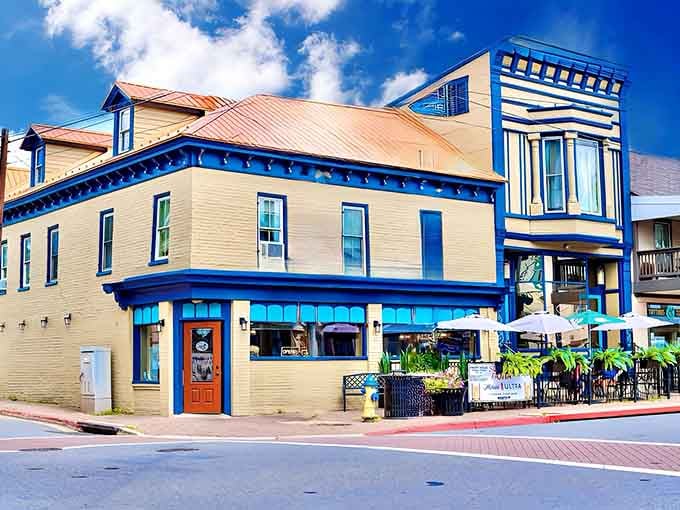 That bold blue trim pops against the sky like a beacon for hungry travelers seeking authentic local flavor and good conversation.
