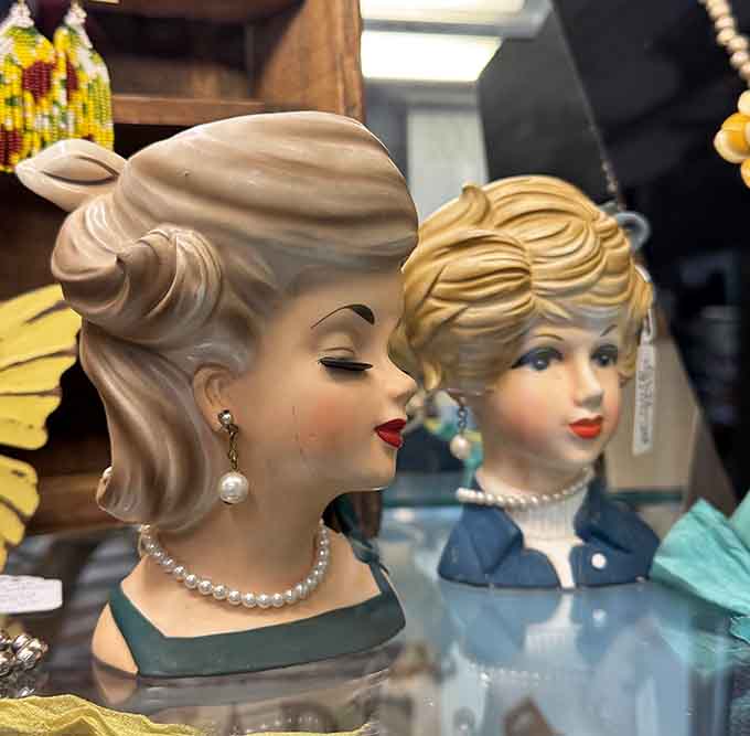 These glamorous ceramic heads with their perfect curls and pearls could've modeled for any 1950s department store window display.