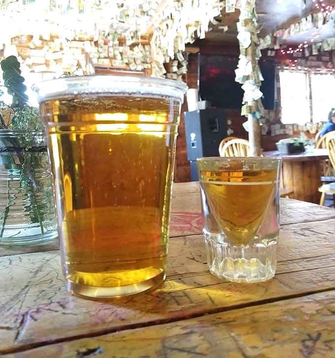 A cold beer and a whiskey shot sitting together on a carved table is basically the mountain version of fine dining.
