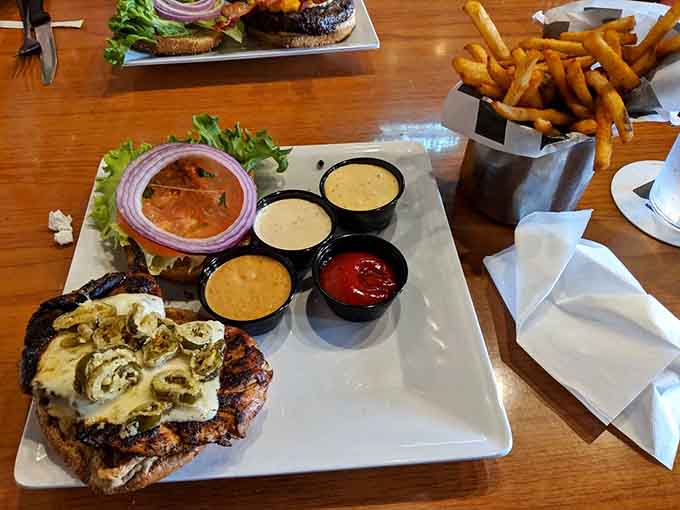 Crispy chicken tenders on a wooden board prove that sometimes the classics just need to be supersized and perfected.
