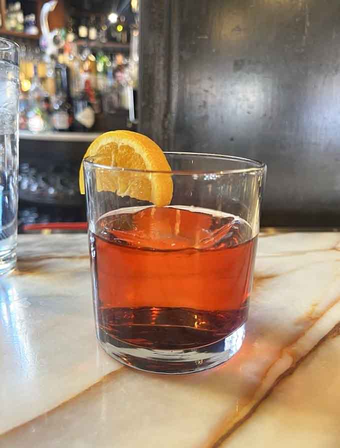 Sometimes you need something stronger than coffee, and this Negroni with its perfect orange garnish delivers beautifully.