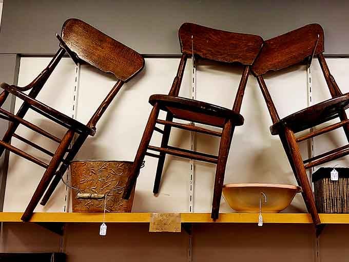 Vintage wooden chairs perched high remind us that even furniture shopping can yield unexpected treasures at outlet prices.