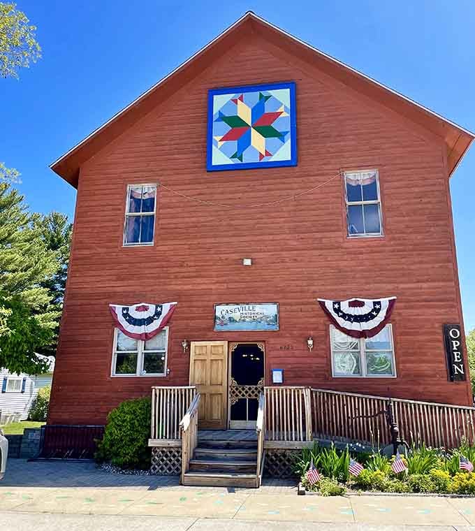 The Caseville Historical Society building wears its patriotic bunting and quilt square like badges of small-town honor and pride.