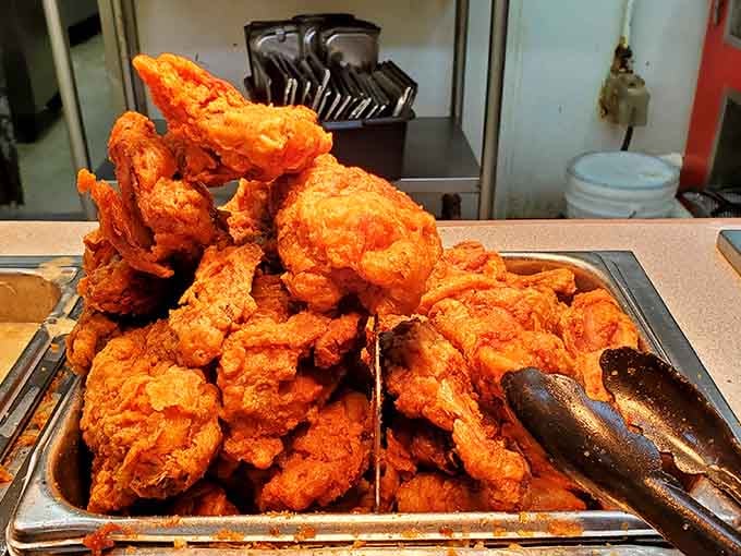That mountain of fried chicken could feed a small army or one very determined individual with excellent priorities.