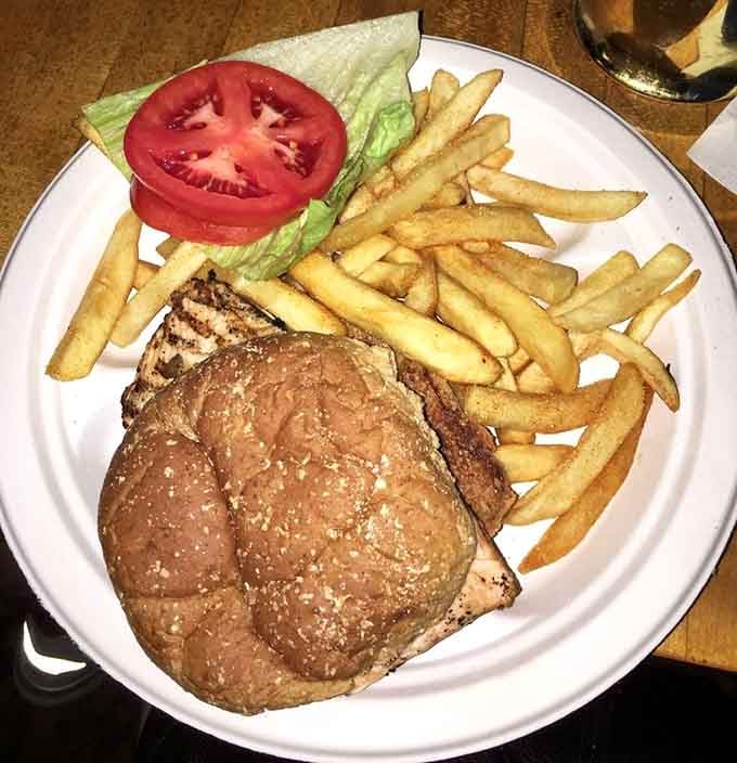 A hearty chicken sandwich with crispy fries proves that comfort food never goes out of style here.