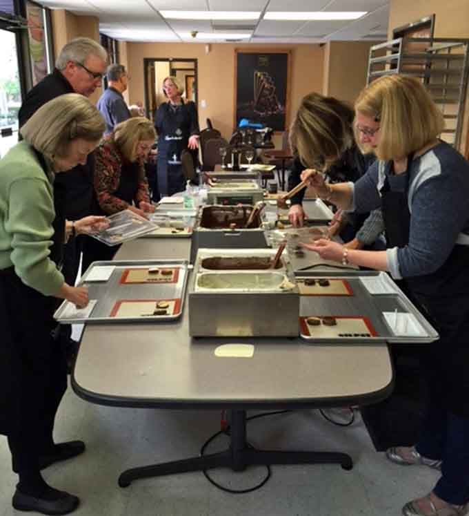Group masterclasses where strangers bond over tempering techniques and emerge as chocolate-making comrades for life, basically.
