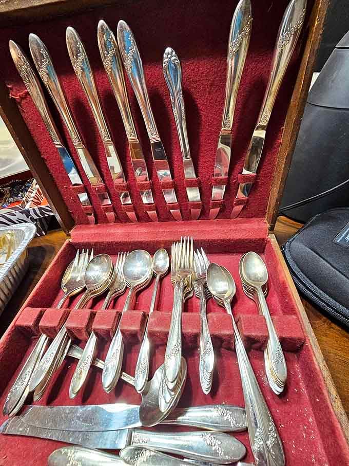 Silver-plated flatware in its original case, because people once cared about proper table settings deeply.