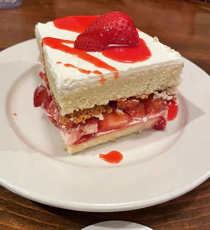 Strawberry shortcake layered like architectural genius, proving dessert can be both beautiful and delicious simultaneously.