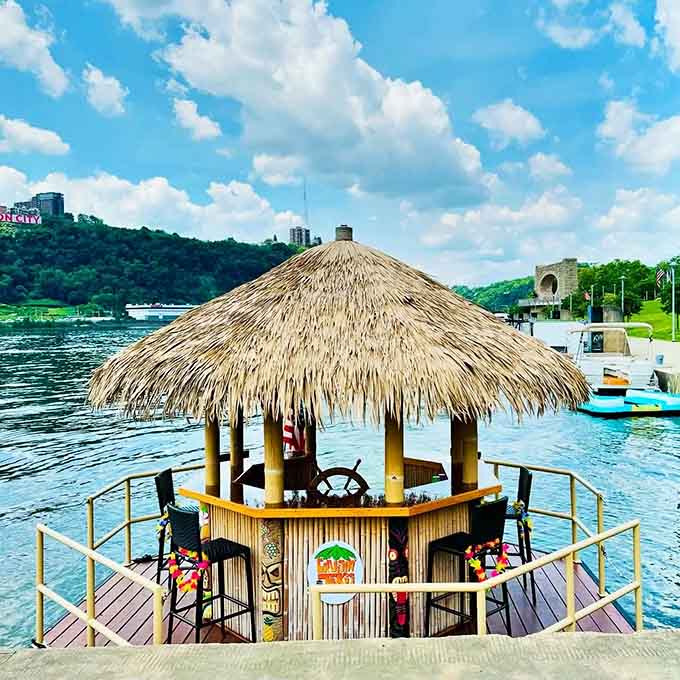 Docked and ready for adventure, this tiki boat waits patiently for its next crew of river-loving party people.