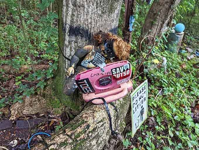 That pink chainsaw's seen better days, but paired with doll parts, it's become oddball art that's pure Atlanta creative spirit.