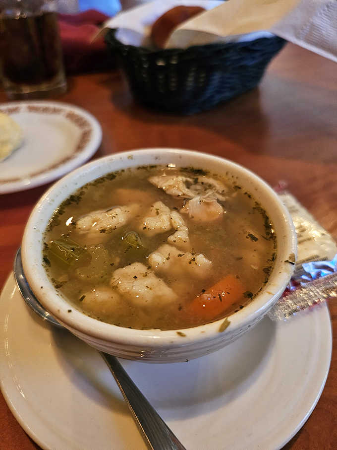 Homemade chicken soup with fluffy dumplings is what your grandmother would make if she had professional kitchen skills.
