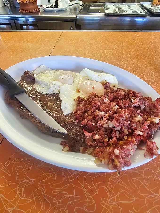 Steak and eggs with corned beef hash proves breakfast doesn't mess around here, delivering serious fuel for serious appetites.