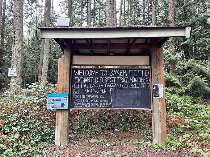 Baker Field's welcome kiosk greets visitors with hand-painted charm, setting expectations for the whimsical adventure ahead on the trail.