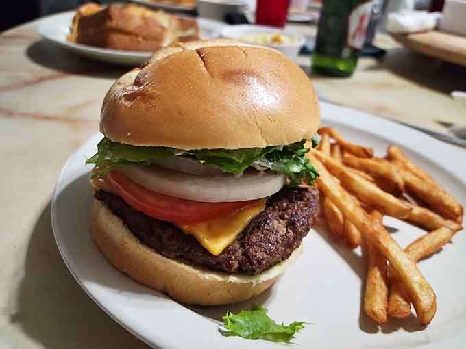 This burger sits pretty with fresh toppings and a perfectly cooked patty that knows how to make friends.