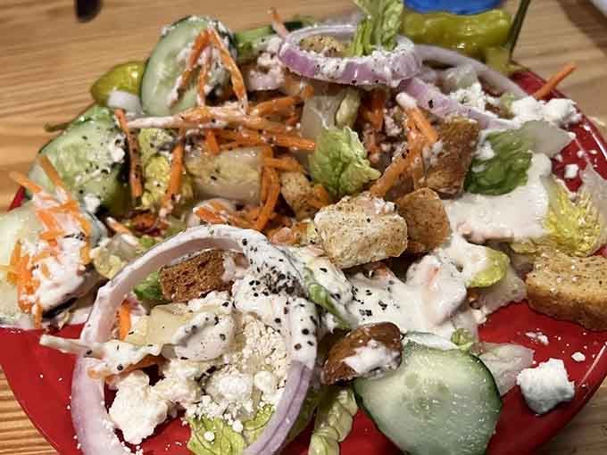 The salad bar offers fresh greens and toppings for those starting light before the main event.