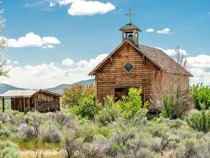 The simple church building with its bell tower speaks to faith that sustained families through unimaginable hardship and isolation.