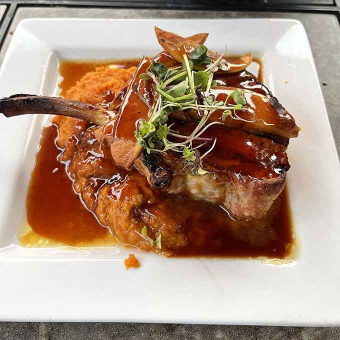 A glazed pork chop this gorgeous reminds you that great steakhouses know their way around all proteins.