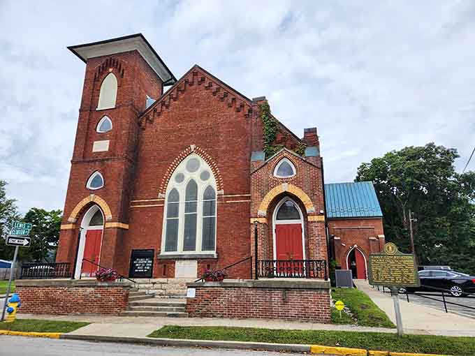 Red brick churches with Gothic arches standing tall like they've been here since medieval times.
