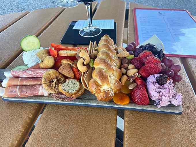 This charcuterie board looks like it raided the best parts of a gourmet market and arranged them into edible poetry.