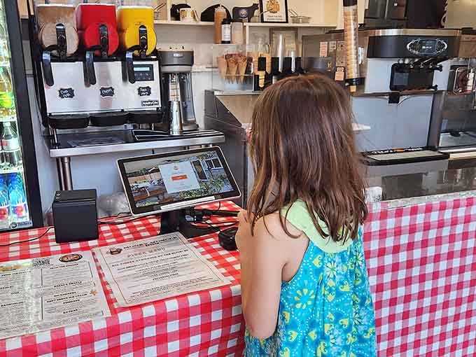 Red gingham tablecloths meet modern ordering – where old-school charm shakes hands with convenient efficiency and everyone wins.