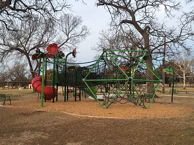 Modern playground equipment meets old-school fun, proving kids still prefer climbing over staring at screens sometimes.